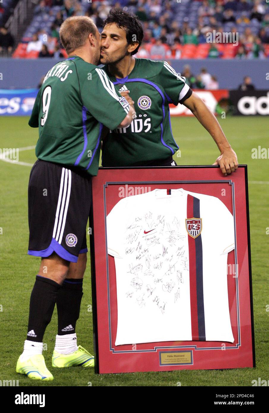 Colorado Rapids' Pablo Mastroeni (25) kisses teammate Clint Mathis (9 ...