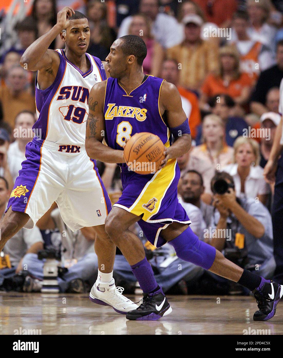 Phoenix Suns' Raja Bell (19) defends Los Angeles Lakers' Kobe Bryant (8 ...