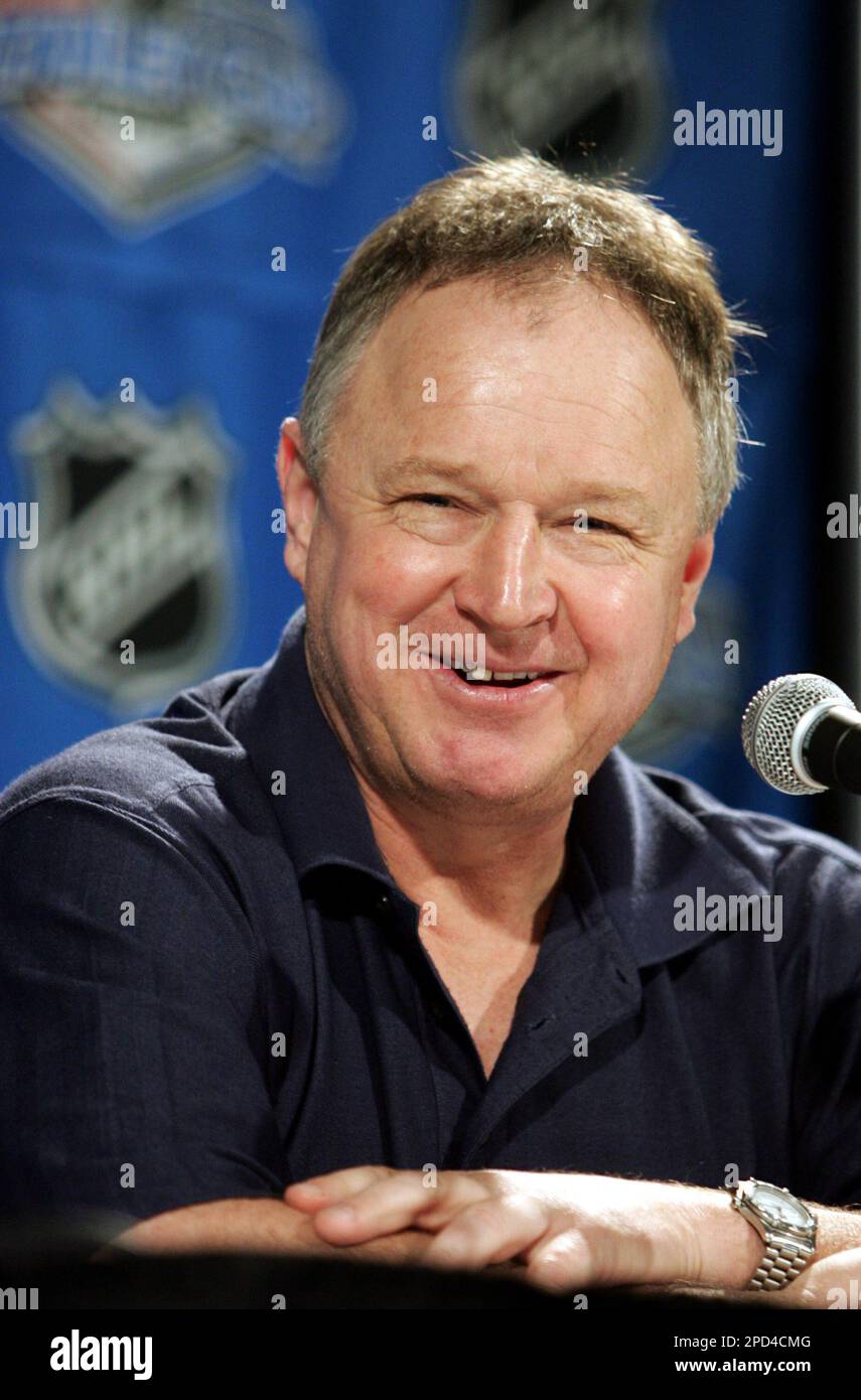 Anaheim Mighty Ducks head coach Randy Carlyle talks with reporters at a ...