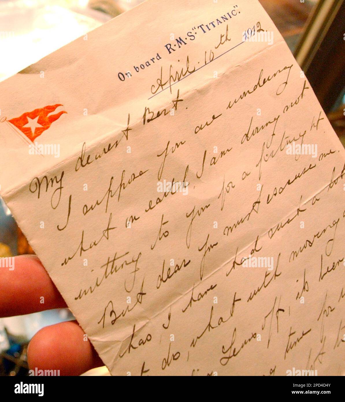 A handwritten letter with the White Star logo and printed "On Board RMS ...
