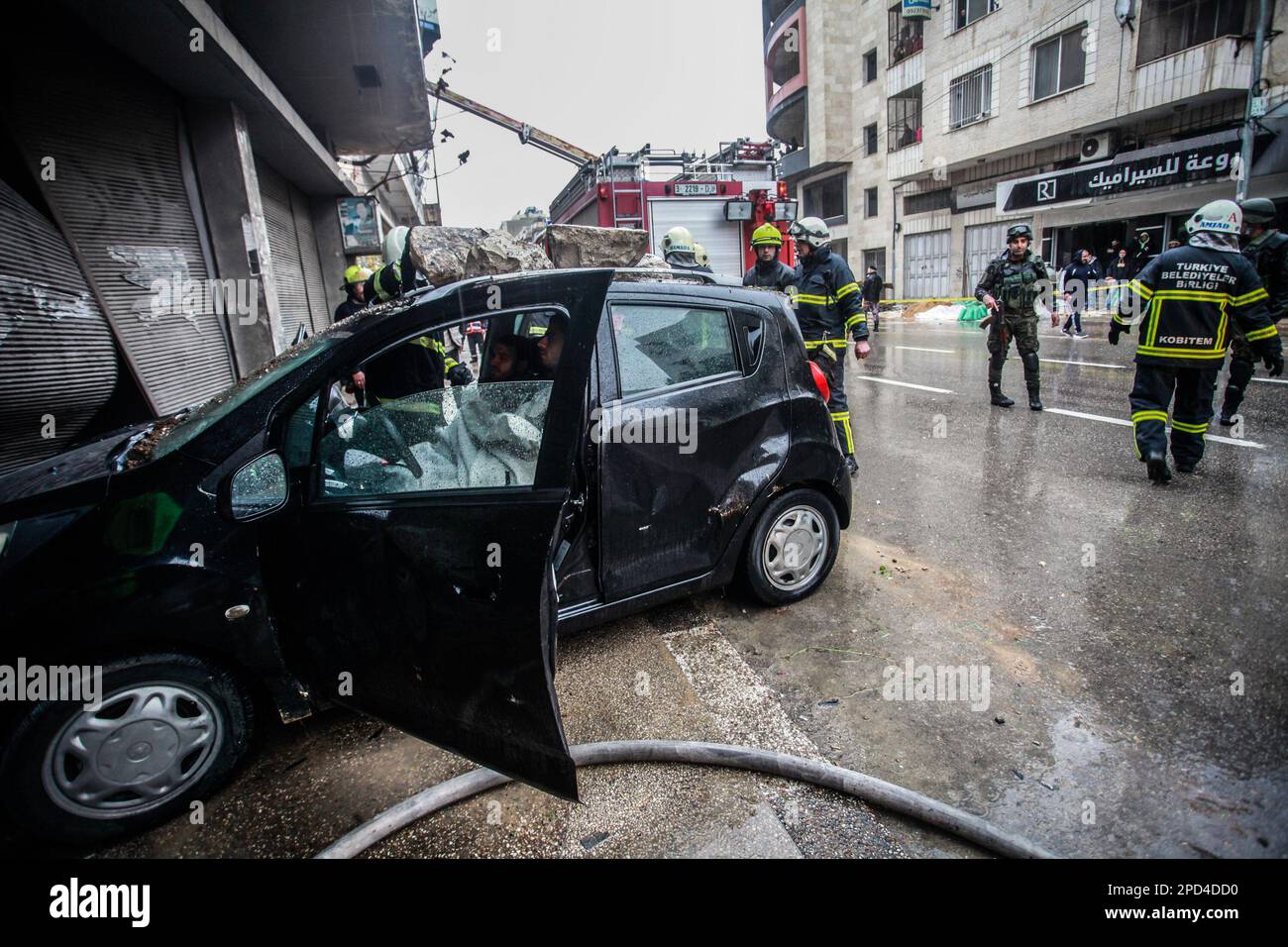 Nablus, Palestine. 14th Mar, 2023. Civil defense officers rescue an ...