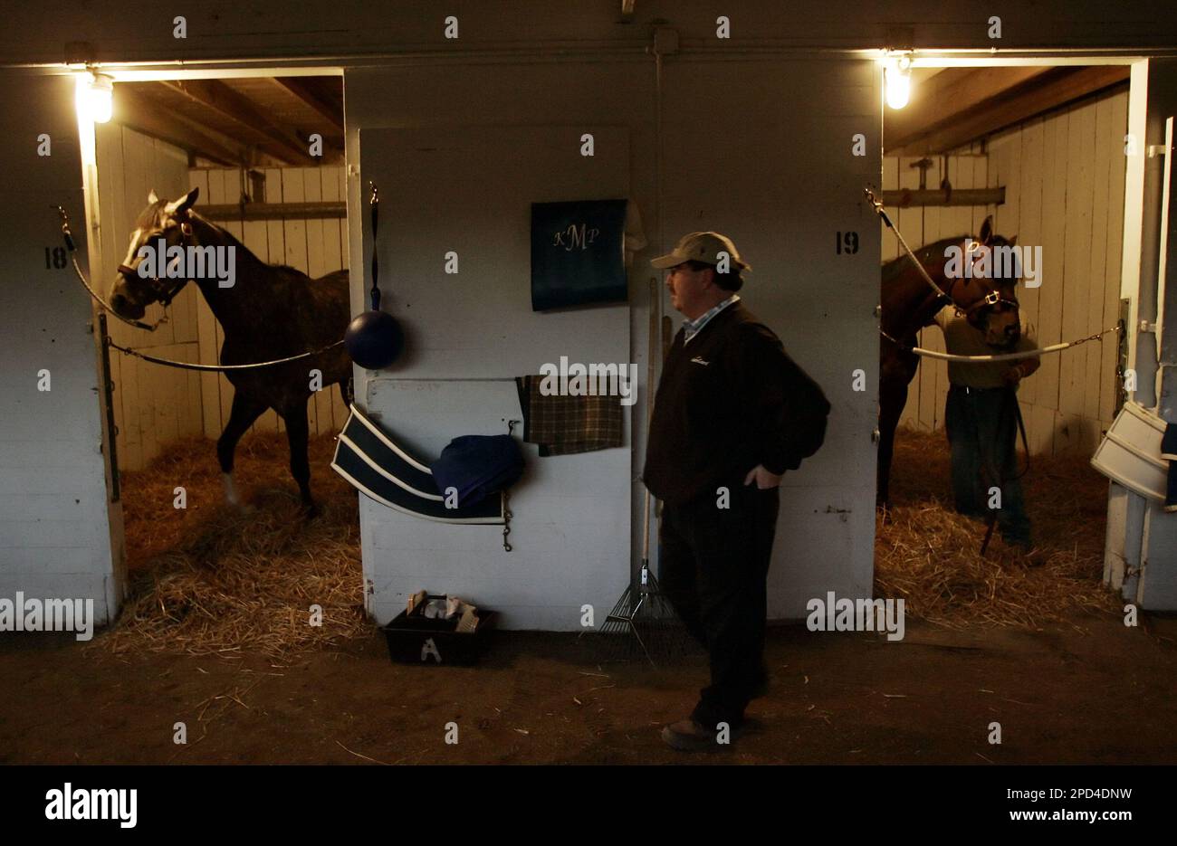Trainer Kiaran McLaughlin stands between the stalls of his Kentucky ...