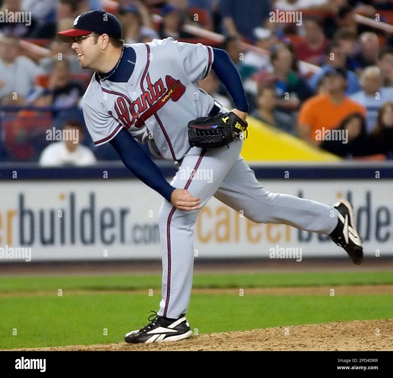 Atlanta Braves pitcher Peter Moylan, of Australia, warms up as he comes ...
