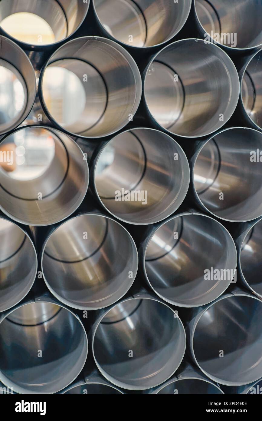 Stacked metal pipes Stock Photo - Alamy