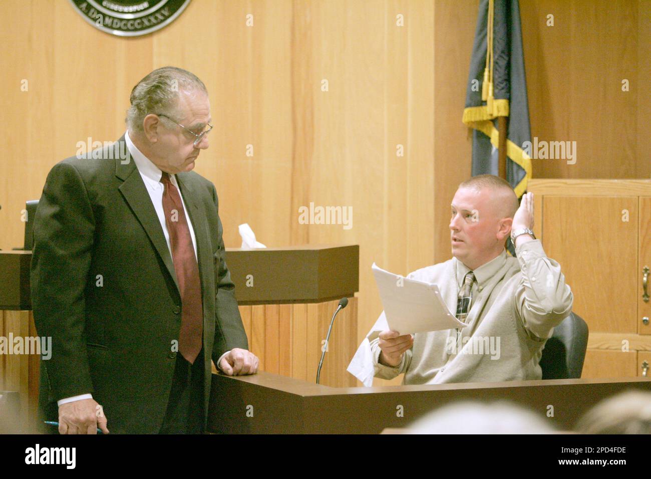 Robert Harrison, left, Mark Unger's defense attorney, cross-examines ...