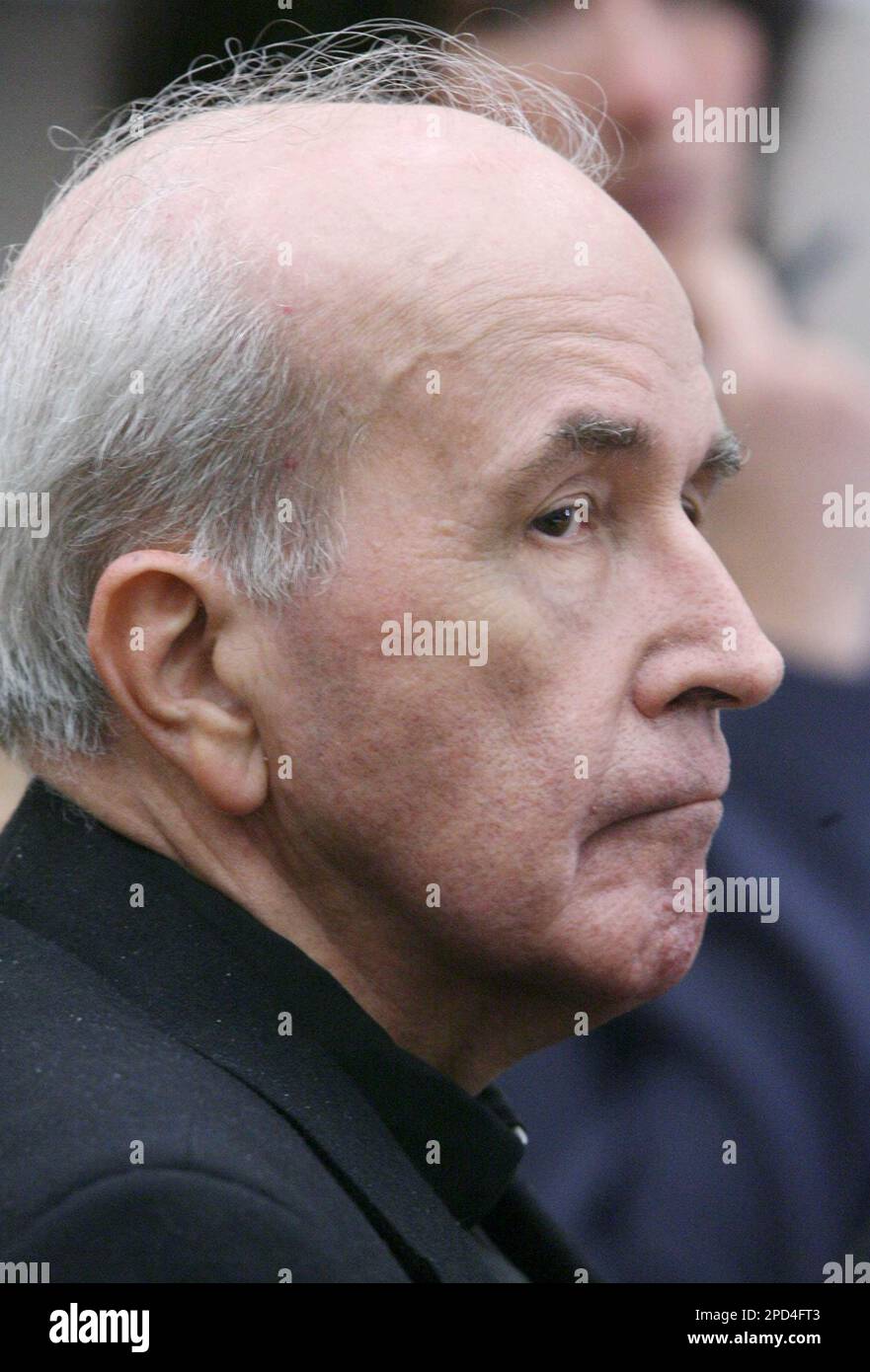 The Rev. Gerald Robinson listens during his murder trial, Friday, May 5 ...
