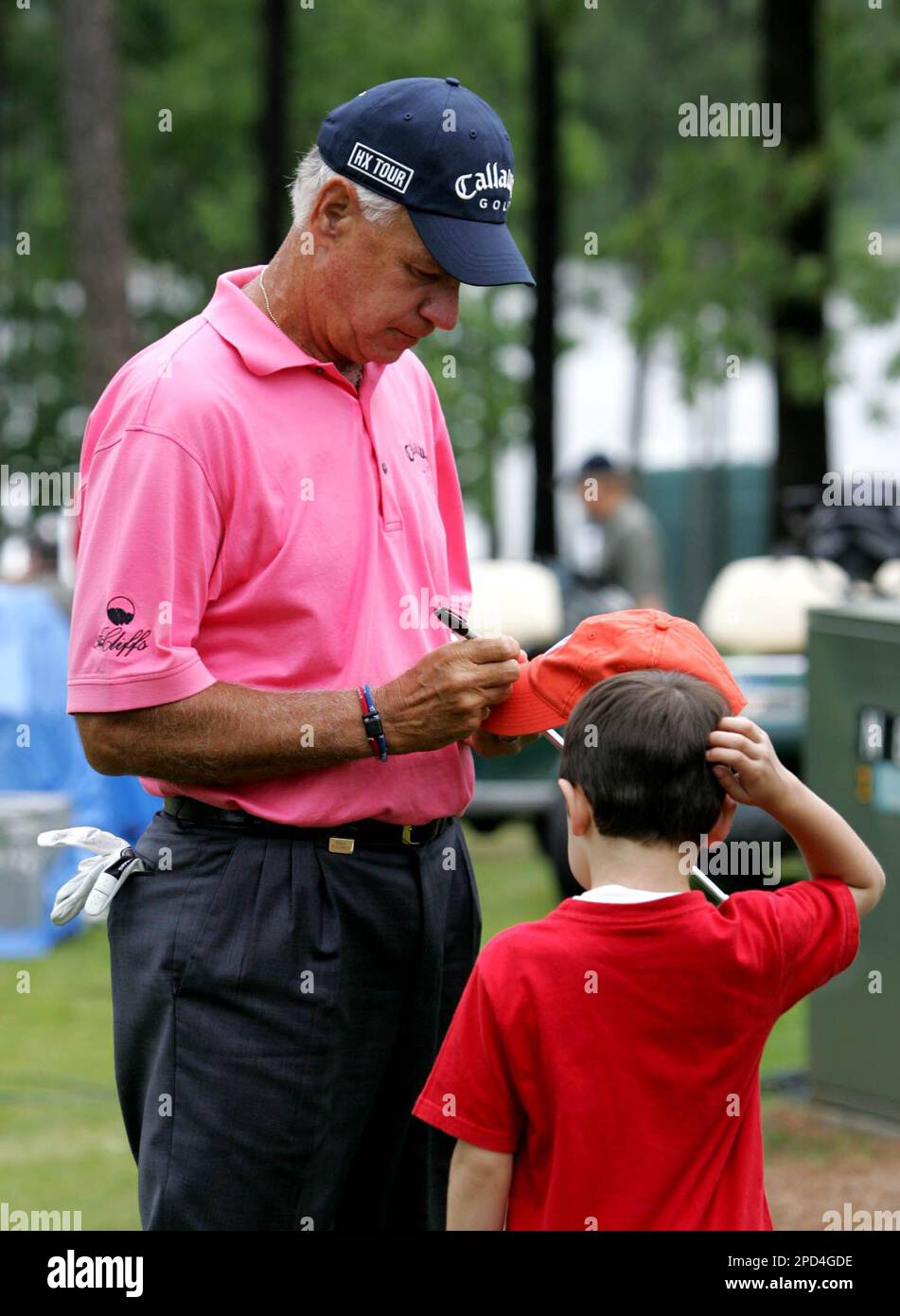 Former winner Bruce Fleisher signs an autograph for Hunter Haynes of ...