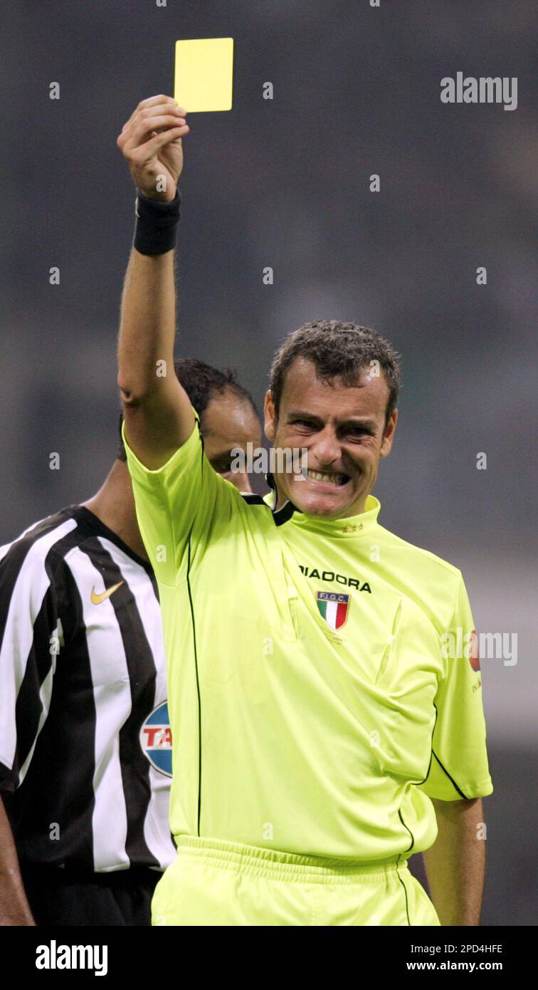 ** FILE ** Italian referee Paolo Bertini shows the yellow card during ...