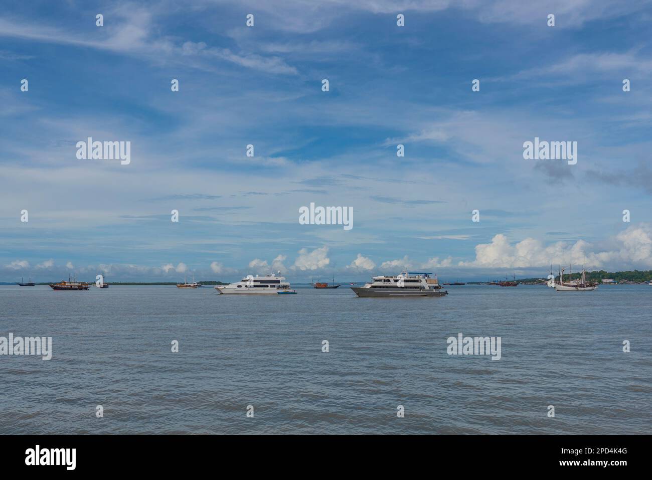 View from the ferry to Waisai at Sorong with cruises and tour boats ...