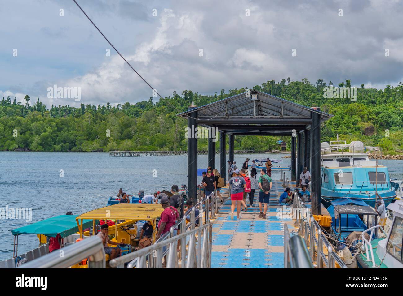 Waisai, Indonesia - February 02, 2023: Passangers on Waisai at the pier ...