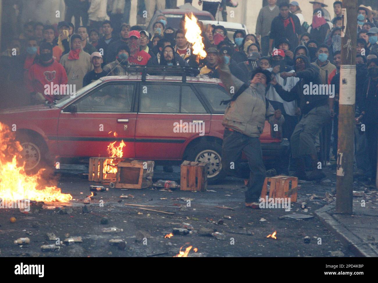Protesters throw molotov cocktails and stones at riot police in the ...