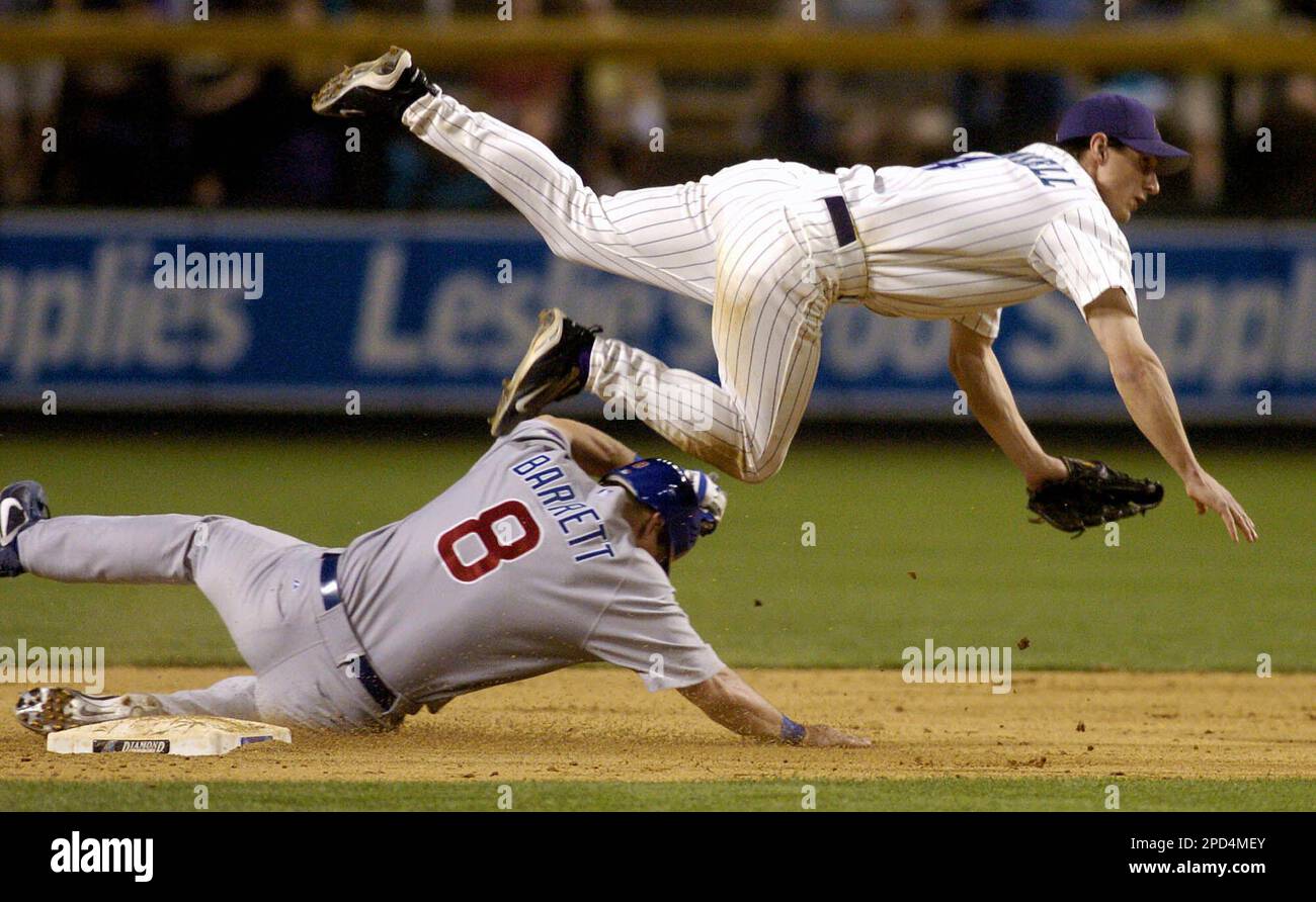 Chicago Cubs' Michael Barrett (8) upends Arizona Diamondbacks shortstop ...
