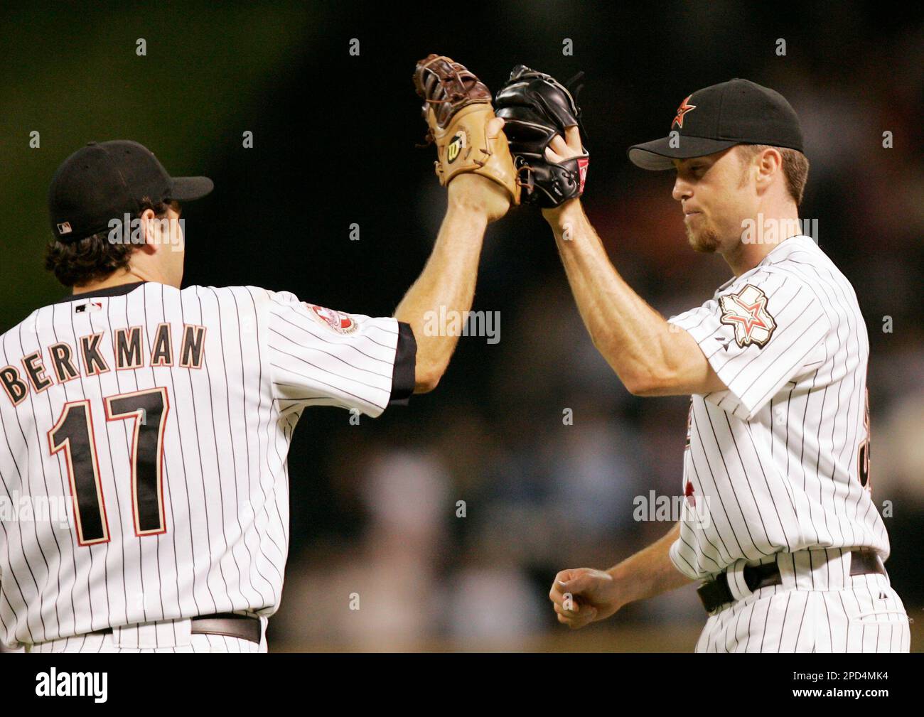 Houston Astros' Brad Lidge, right, and Lance Berkman celebrate after ...