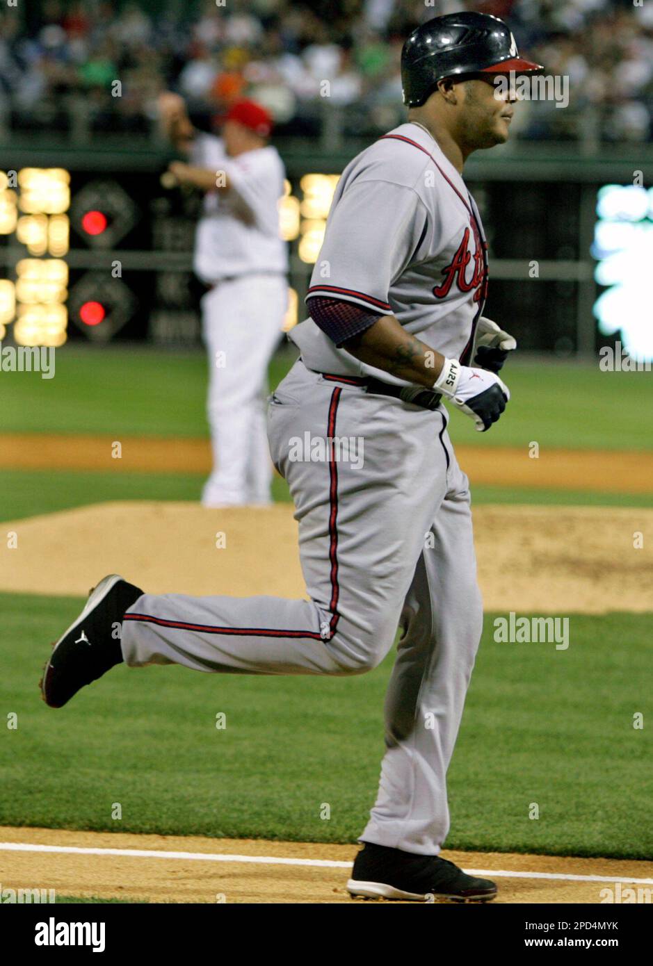 Atlanta Braves' Andruw Jones heads to the plate past Philadelphia ...