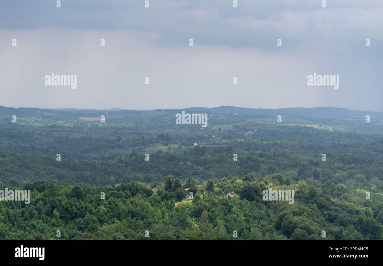 Rural landscape in summer with multiple weather conditions, sun spot on ...