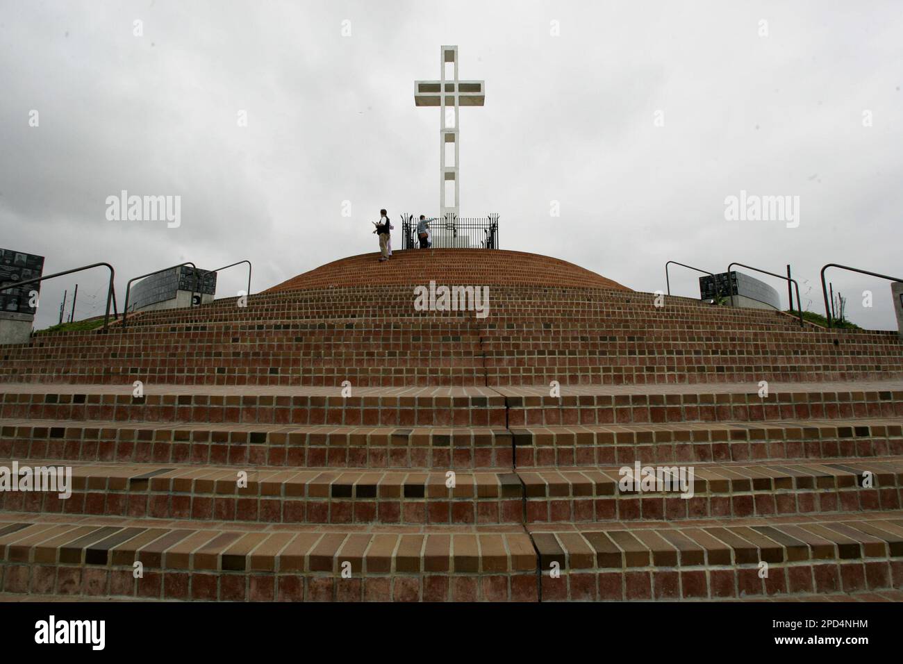 Visitors walk around the 29-foot Mount Soledad Cross at the Mount ...
