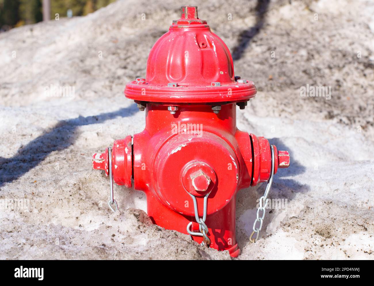 Red fire hydrant half buried in dirty snow. Fire safety and hydrant ...