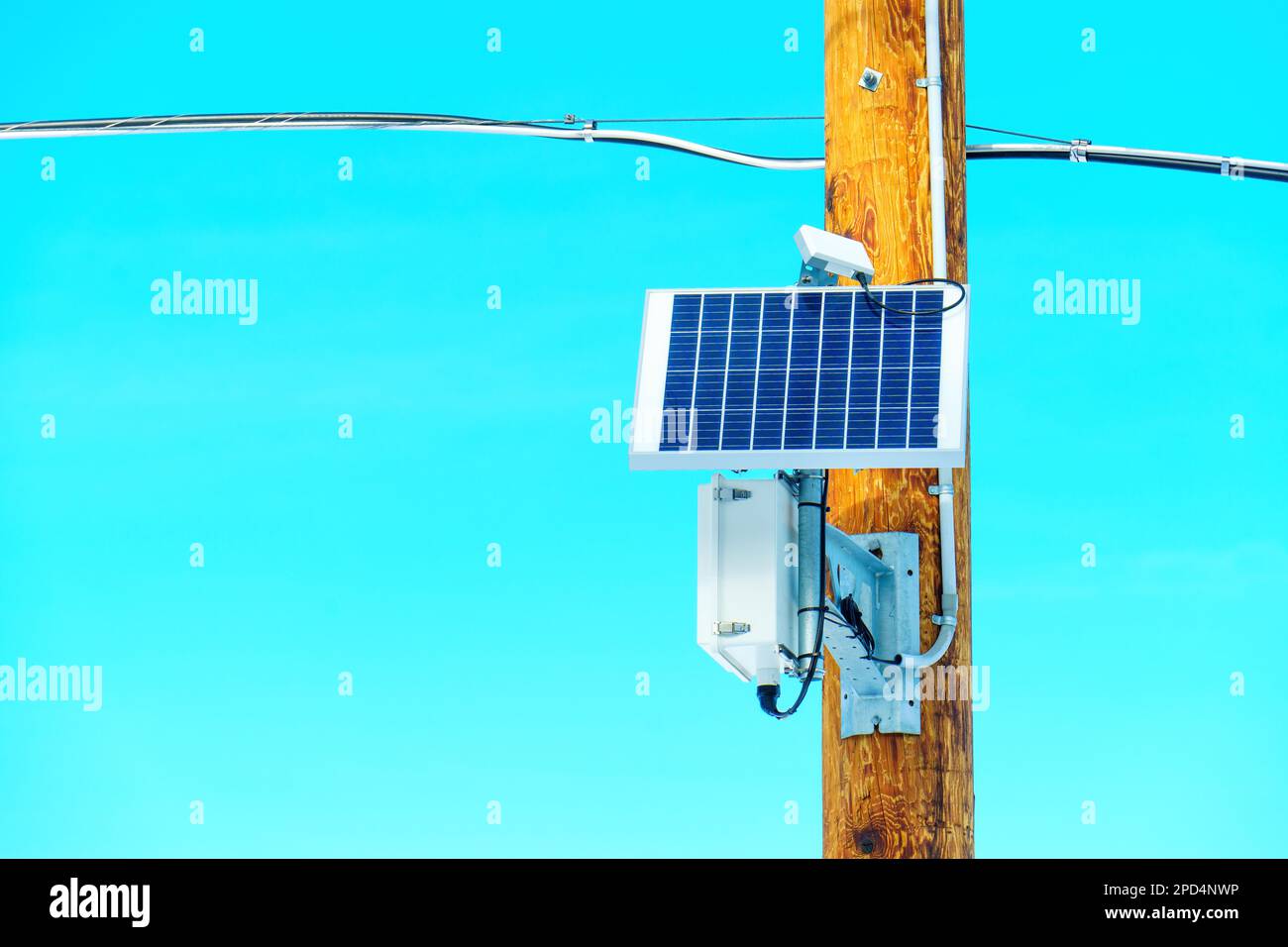 Solar panel and auxiliary equipment mounted on a wooden pole ...