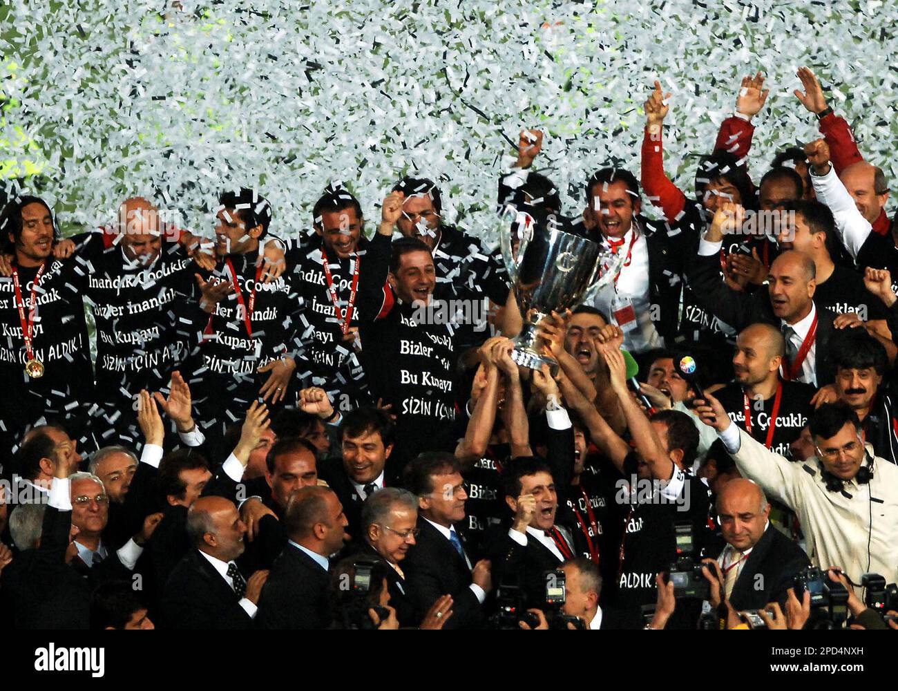 Members of Besiktas soccer team celebrate with the trophy at Ataturk ...