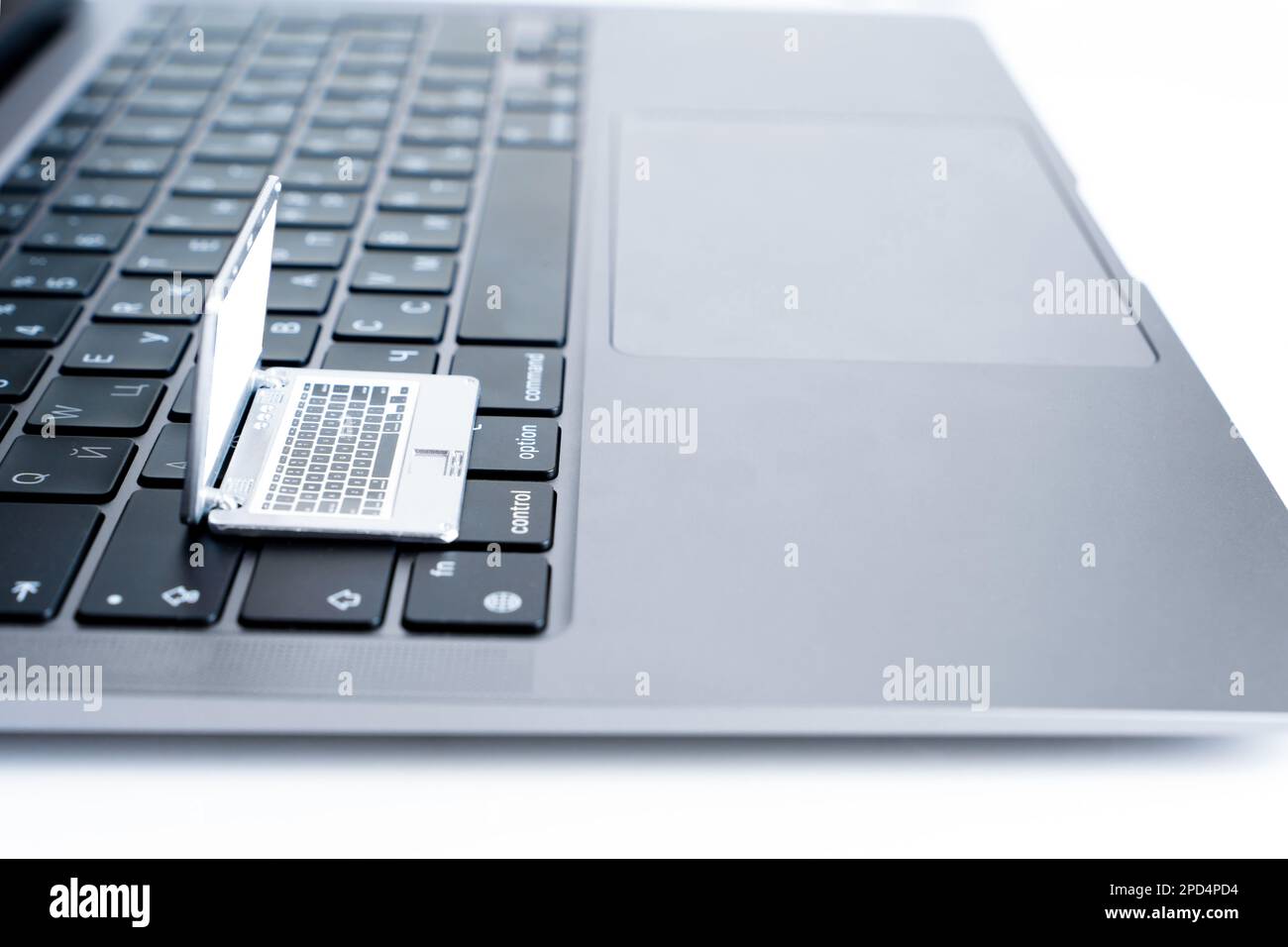 Choosing the right laptop size: Miniature laptop replica placed on the ... Choosing the right laptop size: Miniature laptop replica placed on the ...