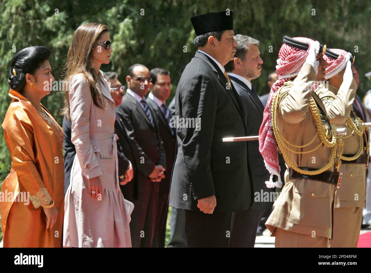 King Abdullah II of Jordan, fourth left, and his wife Queen Rania ...