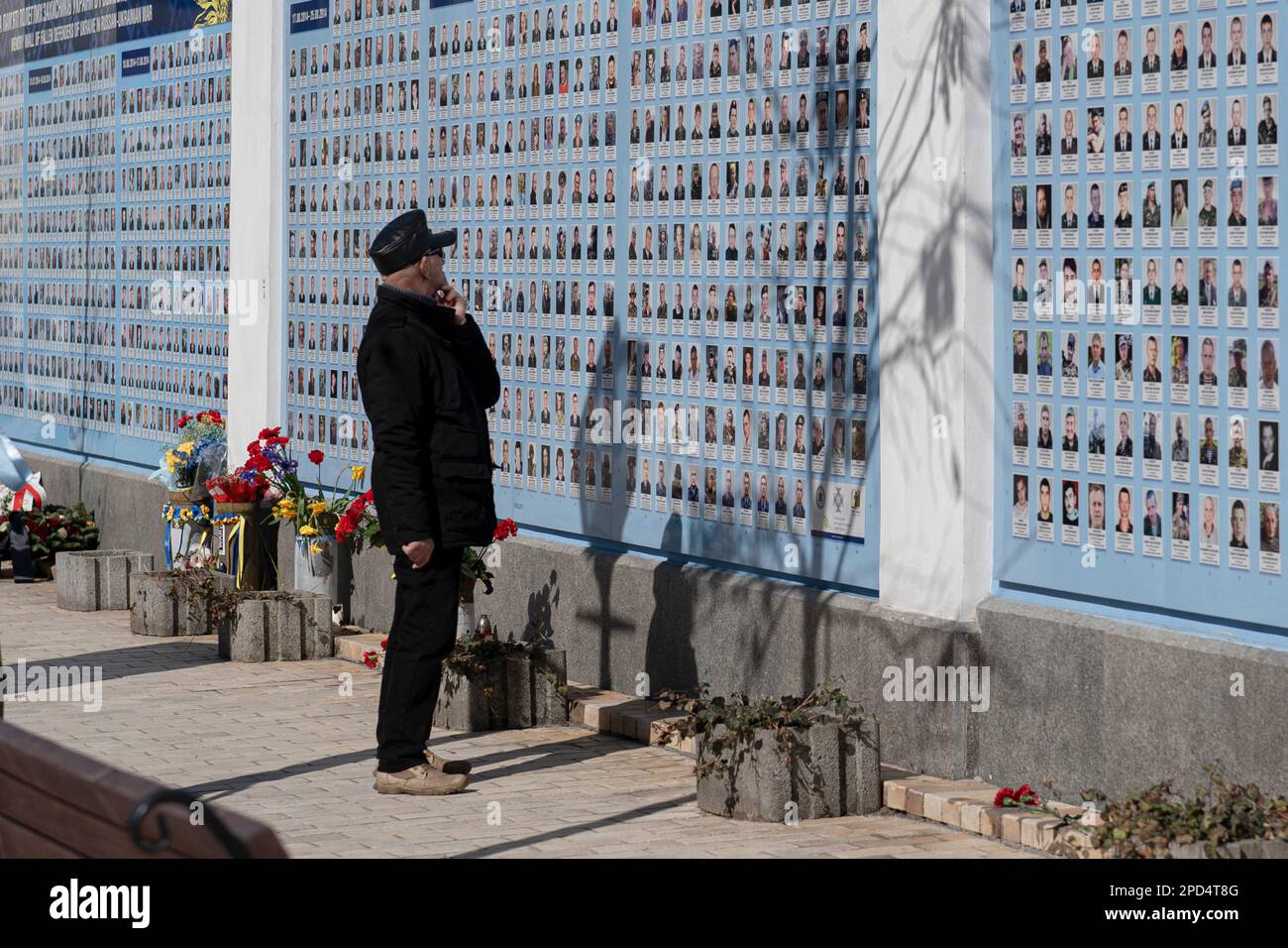 A woman watches the Memory Wall of Fallen Defenders of Ukraine in ...