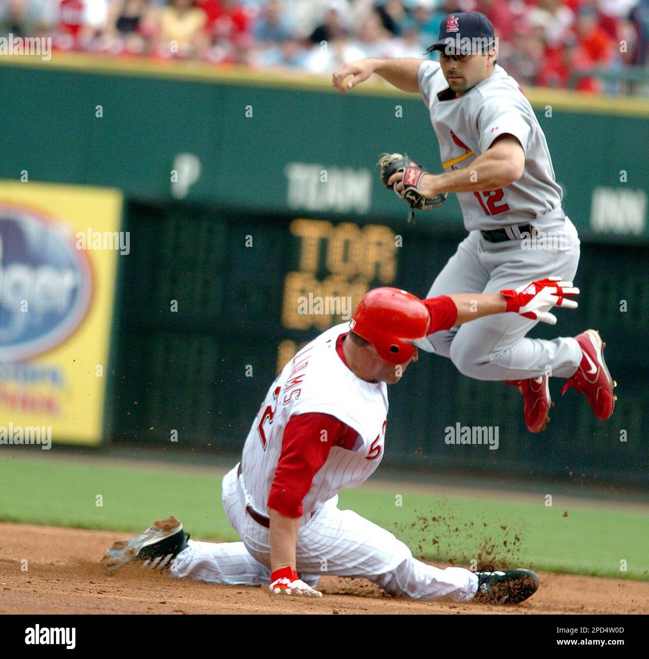Cincinnati Reds pitcher Dave Williams, bottom, breaks up a double play ...