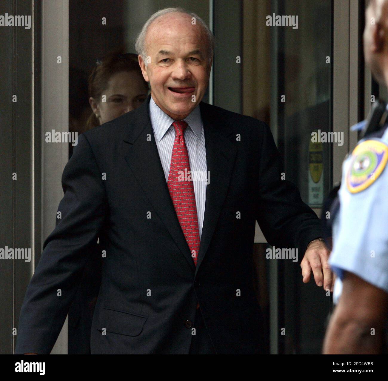 Enron founder Kenneth Lay smiles as he leaves the courthouse for lunch ...