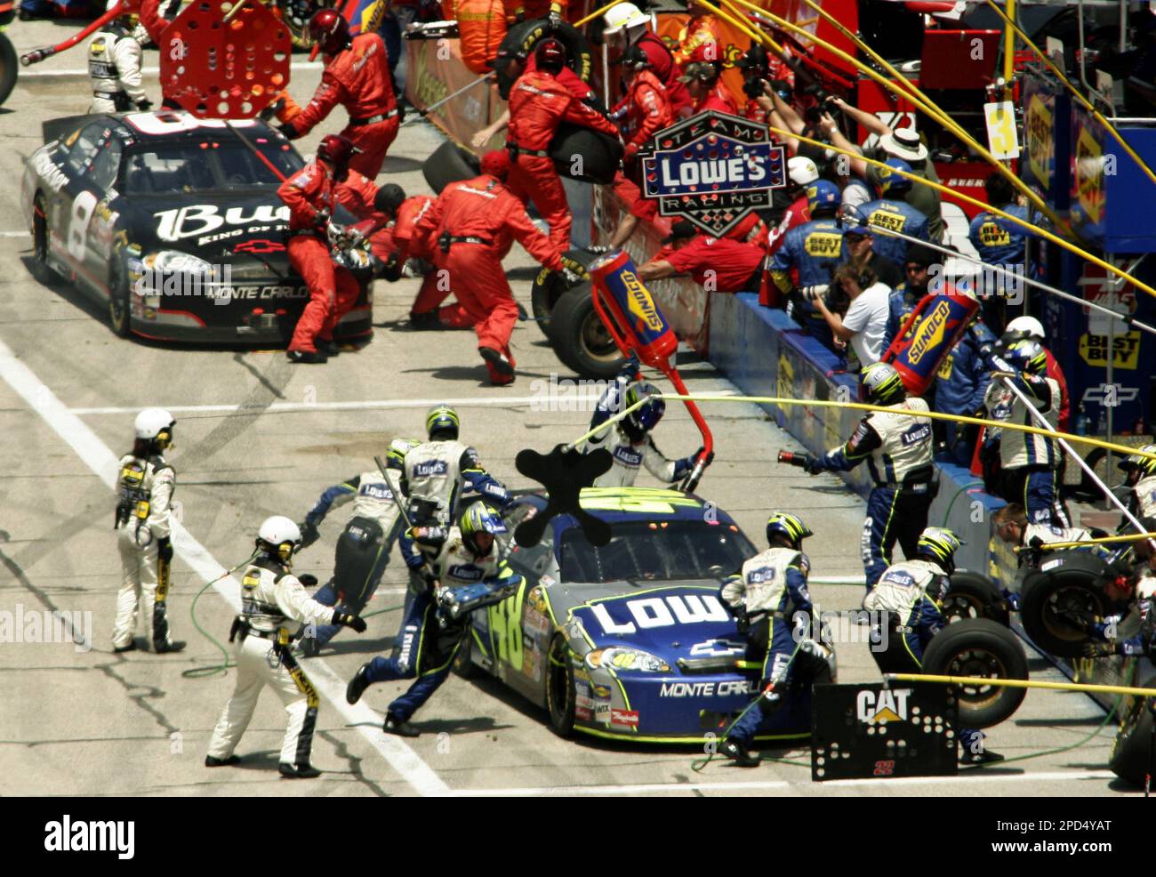 Dale Earnhardt Jr. (8), and Jimmie Johnson (48), make a pit stop during ...
