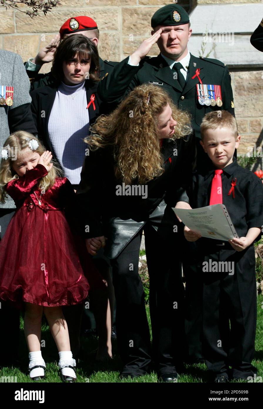 Family members of Cpl. Randy Payne, who was killed in Afghanistan, look ...