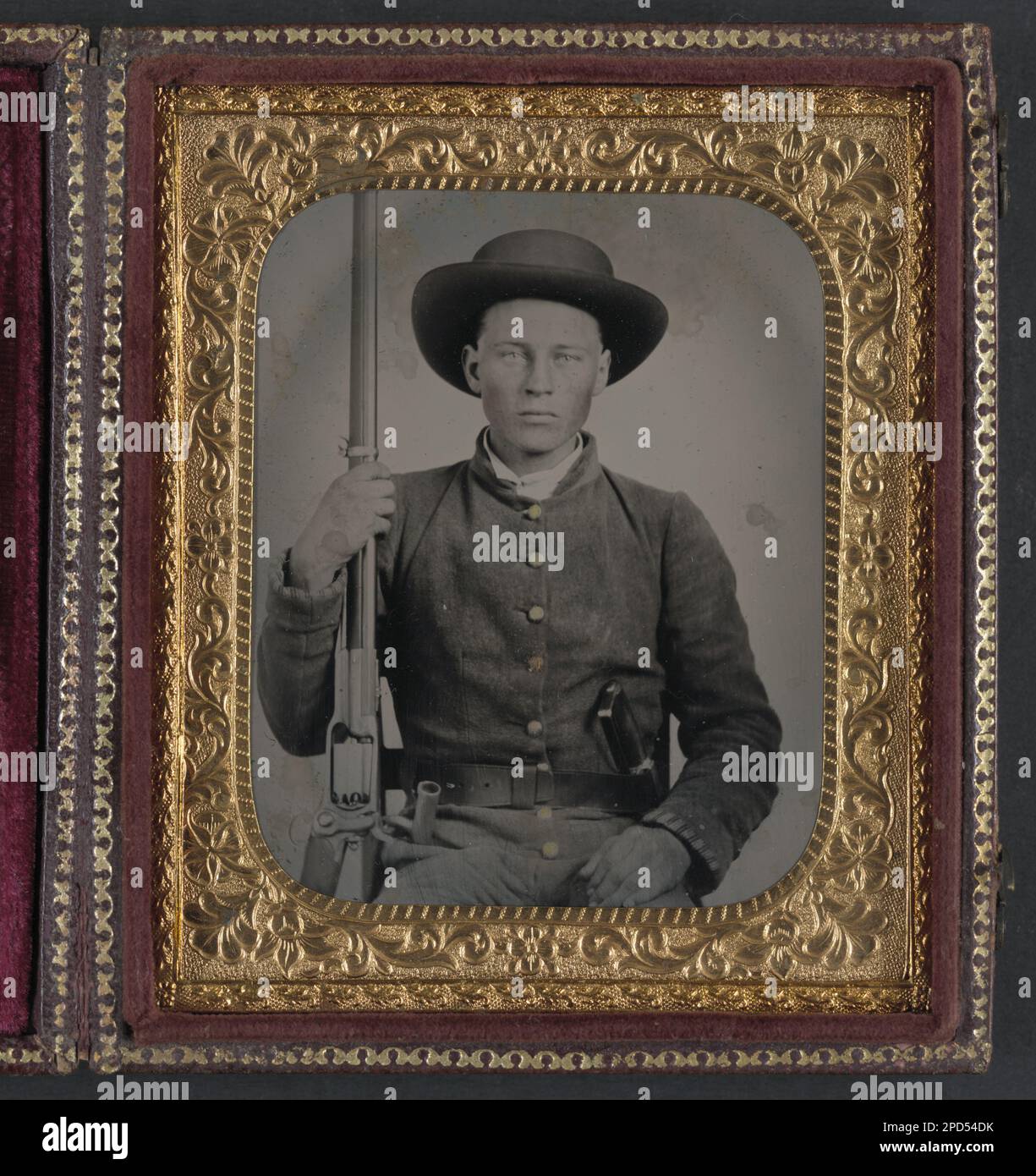 Unidentified soldier in Confederate uniform with Colt Revolving rifle ...