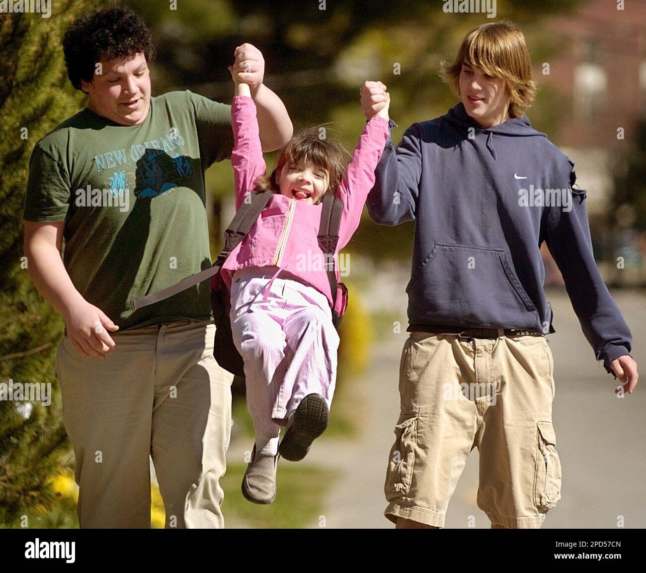 Julia Armington is flung into the air by her brother, Adam Tobey, left ...