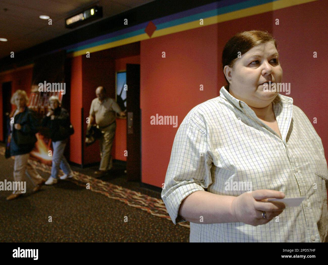 Debbie Nelson stands outside the movie theater in Johnstown, Pa., after ...