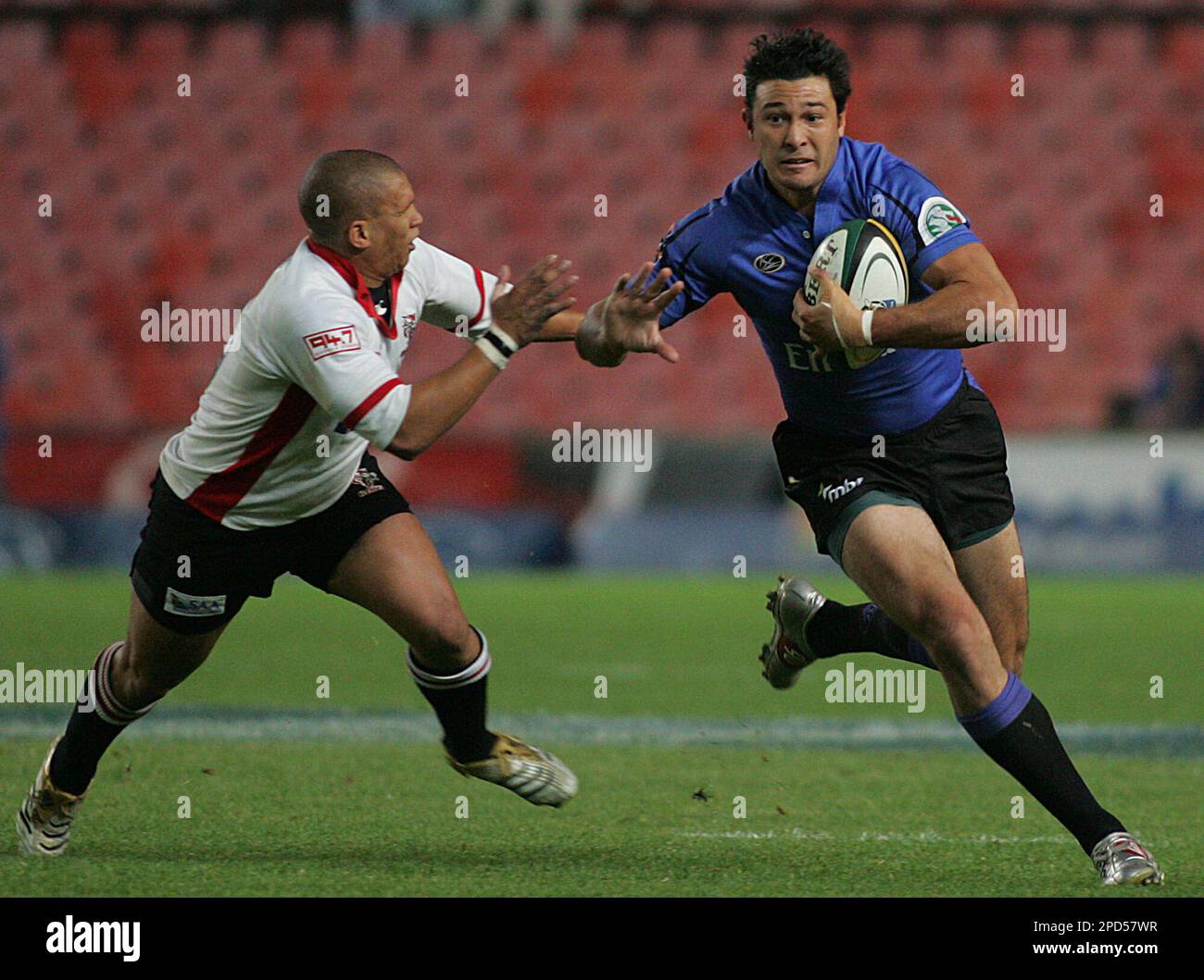 Australia's Western Force Cameron Shepherd, right, avoids a tackle from ...