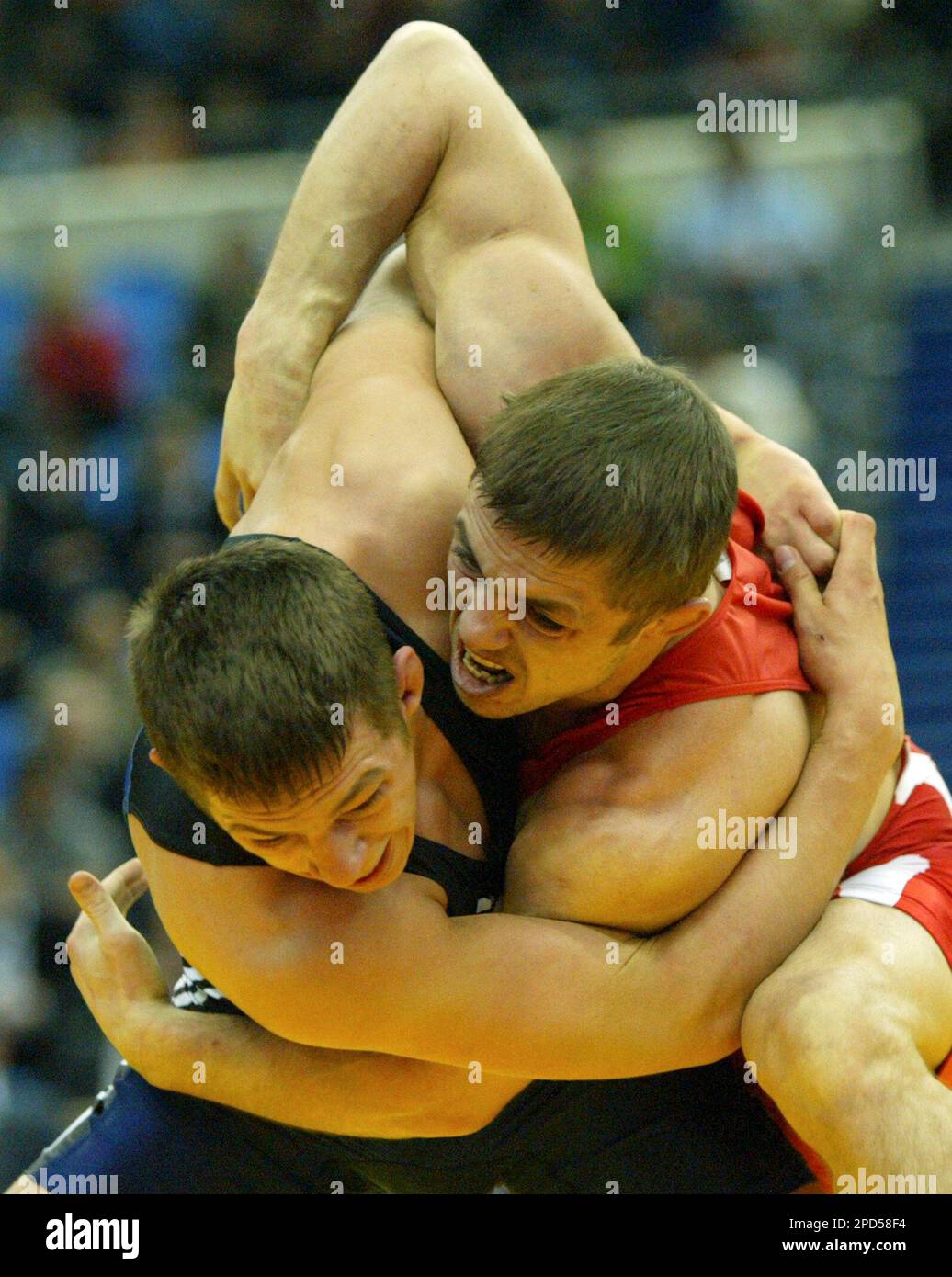 Russia's Sergey Kovalenko, right, and Hungary's Tamas Lorincz wrestle during the Greco-Roman ...