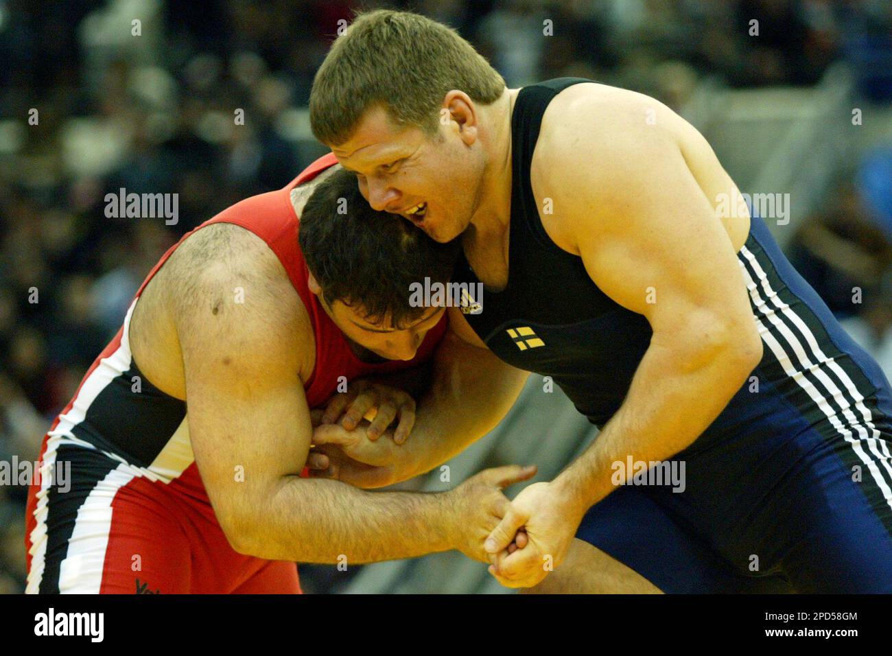 Turkey's Ismail Guzel, left, and Finland's Juha Ahokas wrestle during ...