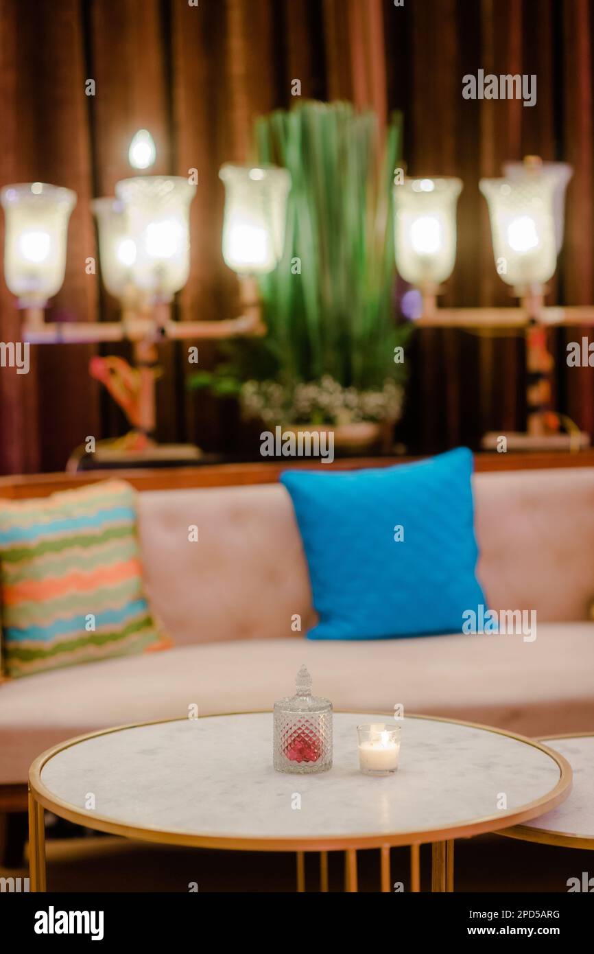 A spacious and cozy room with multiple comfortable couches and tables ...