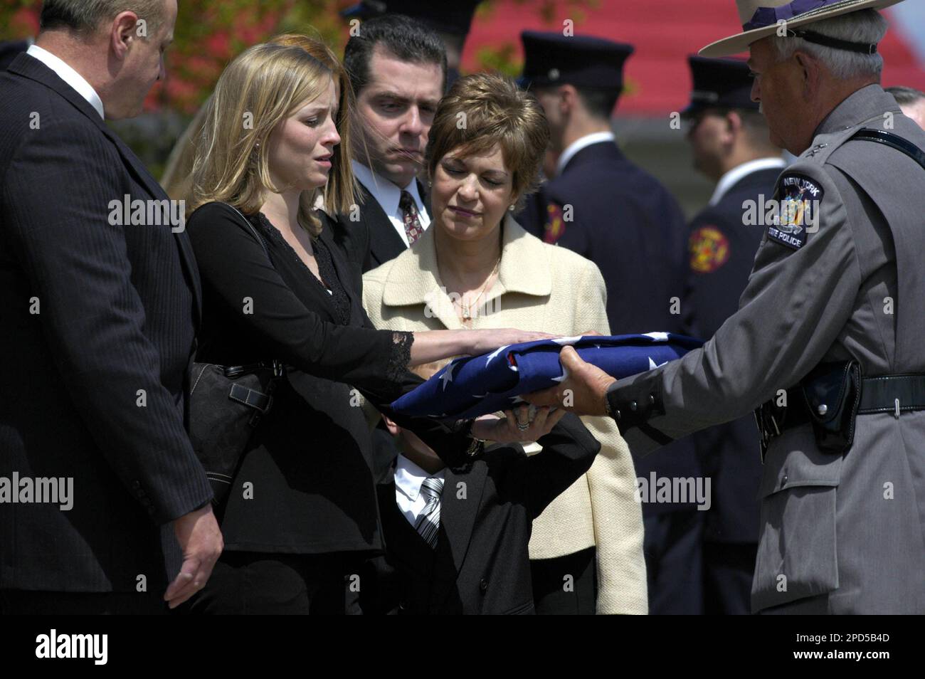 Kristi Todeschini receives a flag from New York State Trooper ...