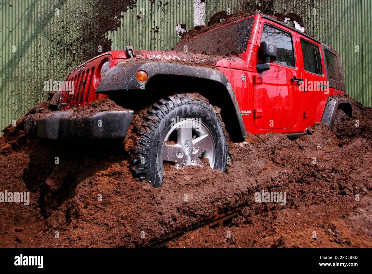 **FILE** A 2007 four-door Jeep Wrangler is still partially covered in ...