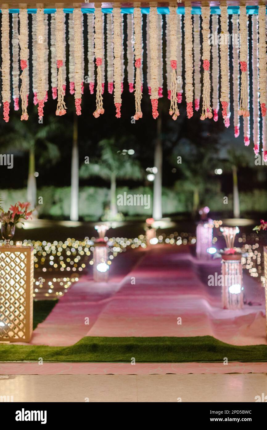 A vibrant display of colorful garlands and flowers suspended from the ...