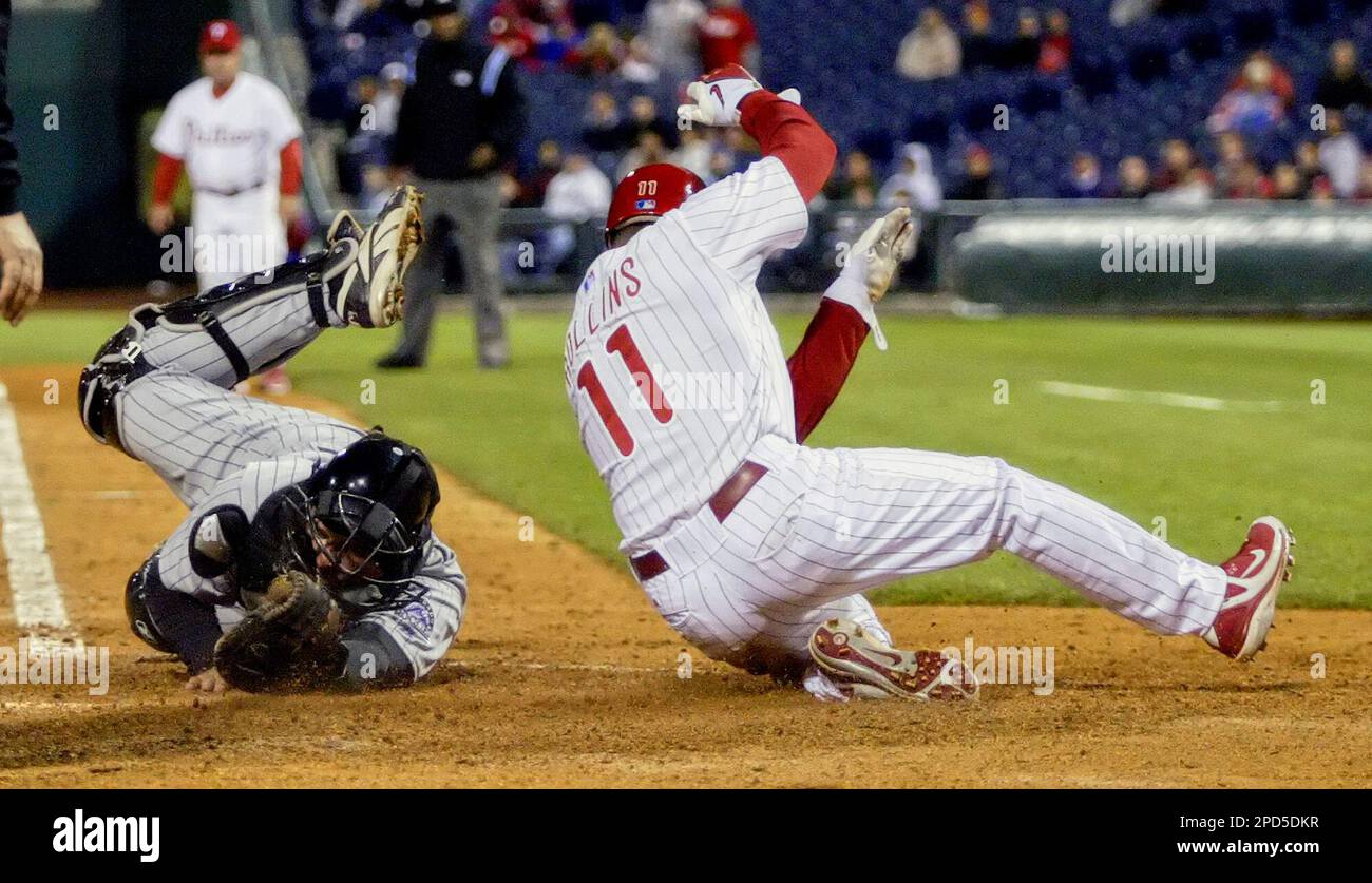 Colorado Rockies catcher Danny Ardoin misses the tag on Philadelphia ...