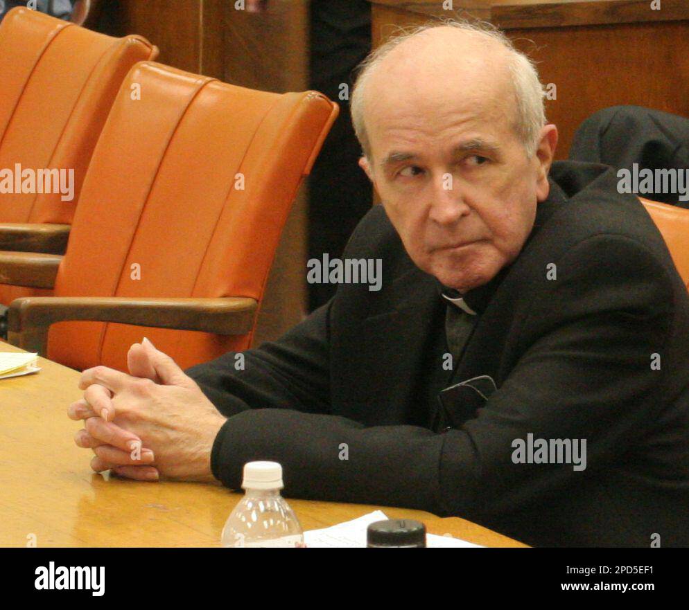 The Rev. Gerald Robinson waits for a new witness to take the stand ...
