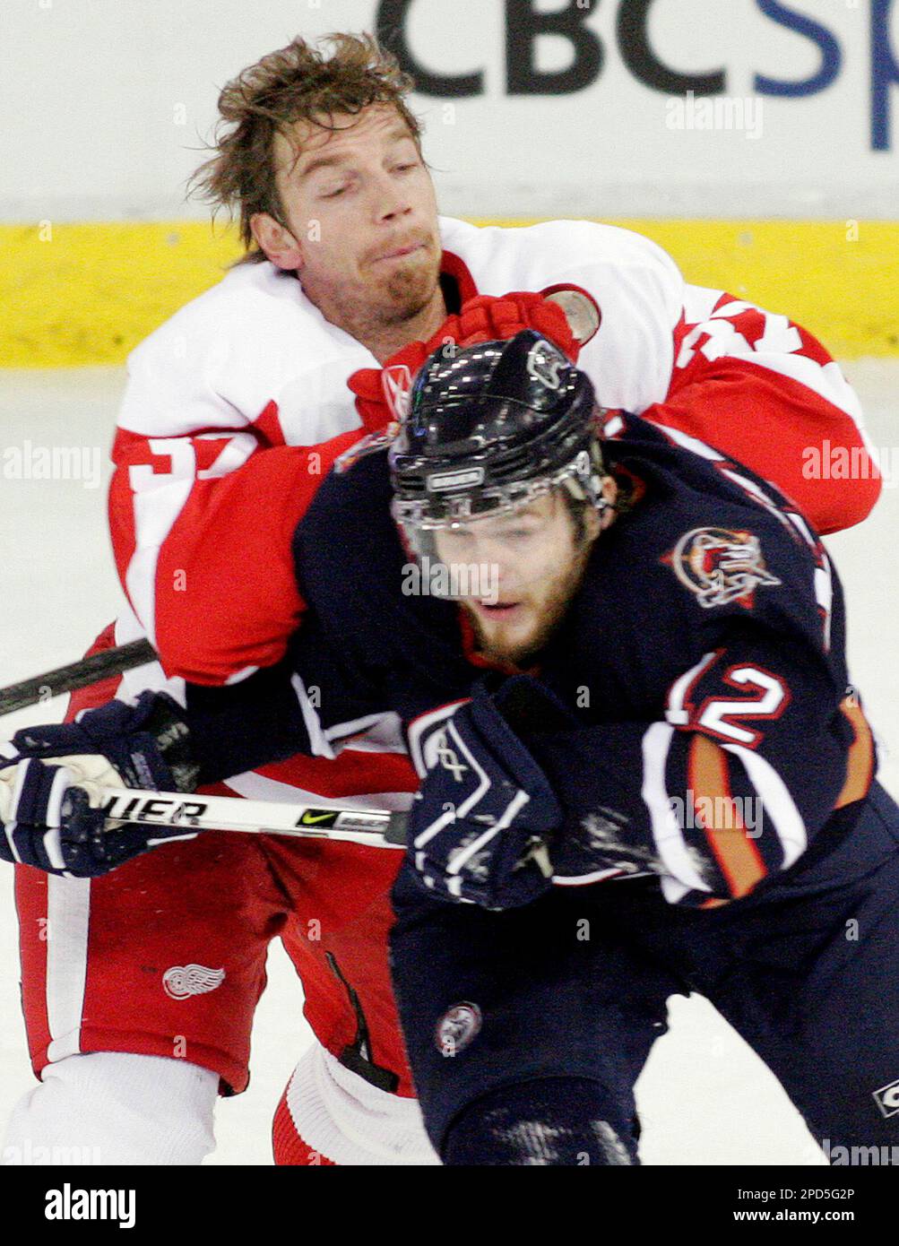 Detroit Red Wings' Mikael Samuelsson, left, battles with Edmonton ...