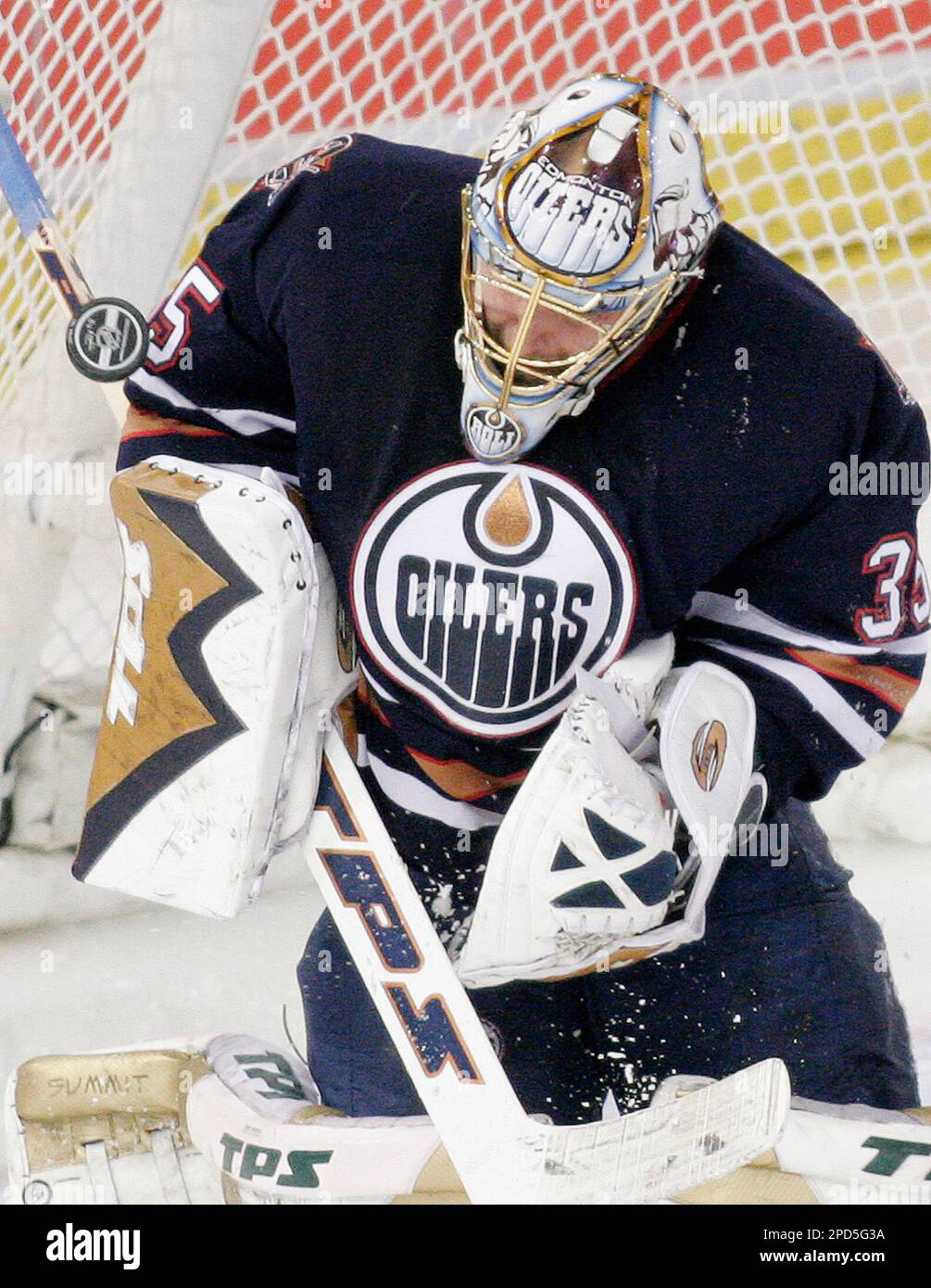Edmonton Oilers goalie Dwayne Roloson deflects a shot from the Detroit ...