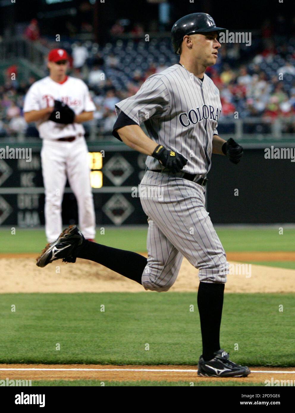 Colorado Rockies Clint Barmes go by Philadelphia Phillies pitcher Gavin ...