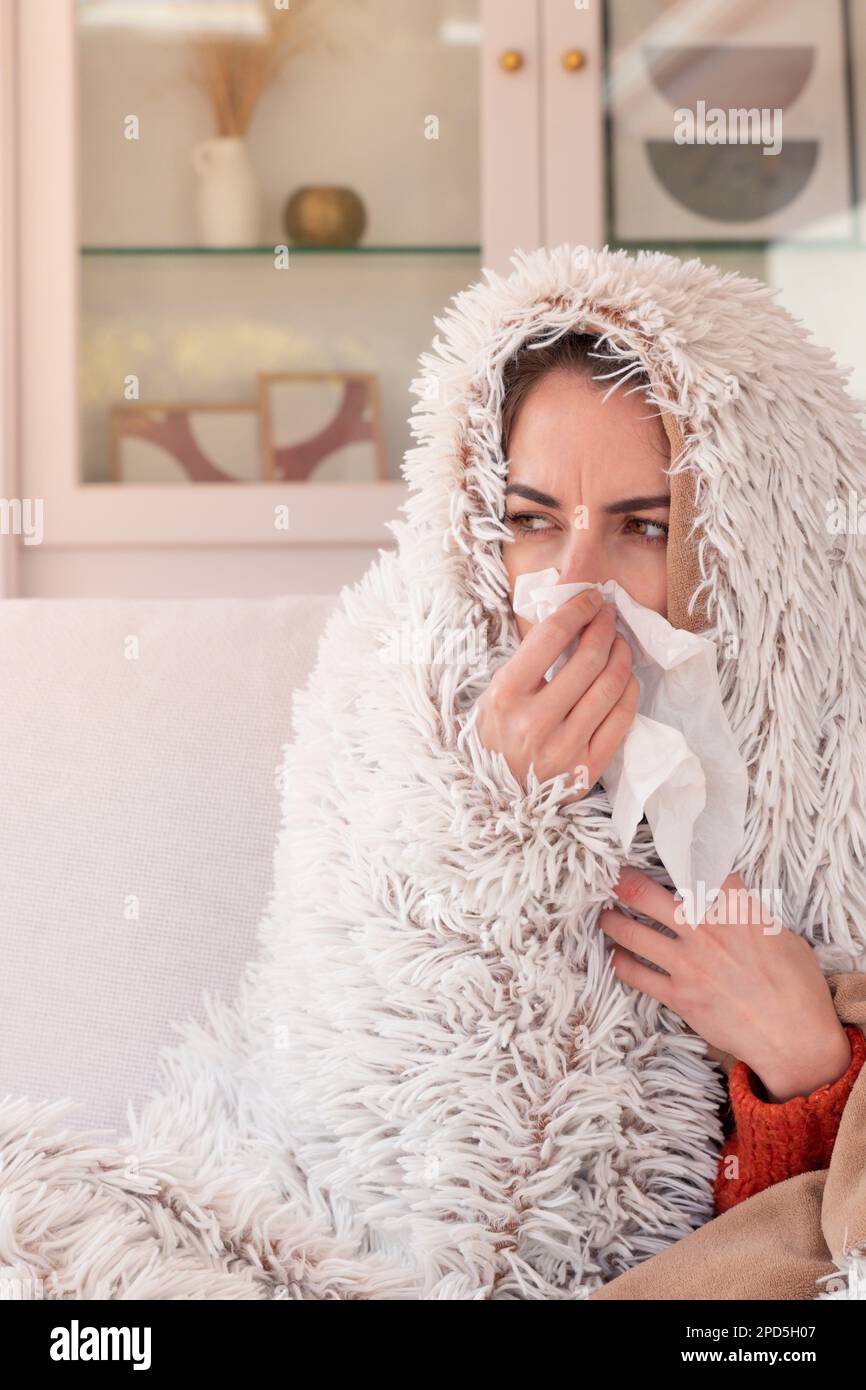 Flu sick female with cold fever blowing running nose with handkerchief ...