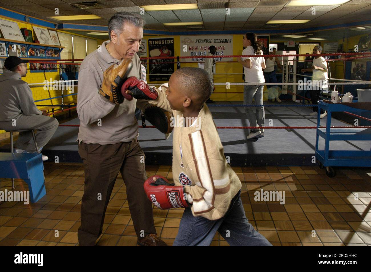 ** ADVANCE FOR APRIL 28-30 ** Ray Rinaldi, left, trains Jamel Jones ...