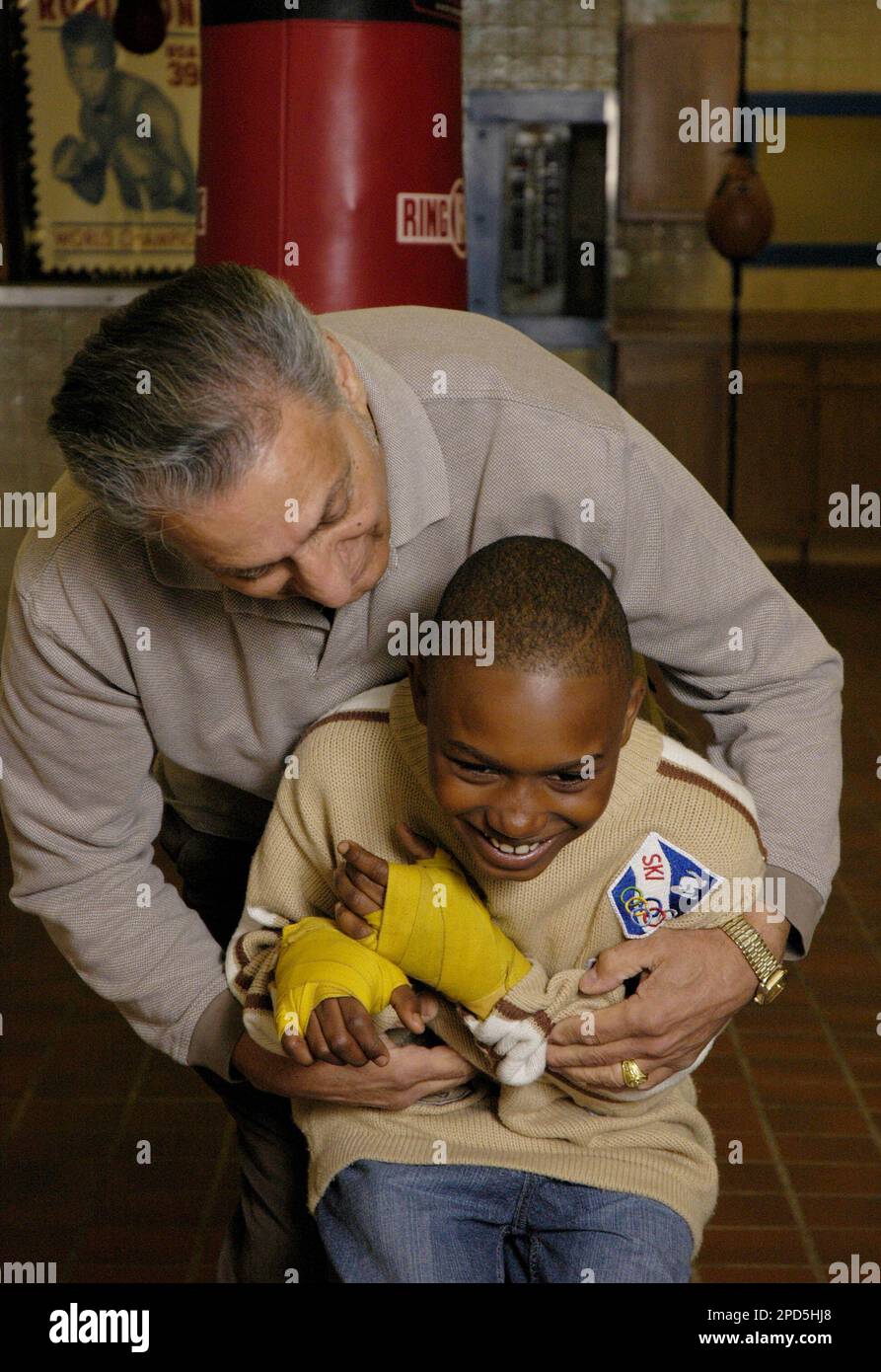 ** ADVANCE FOR APRIL 28-30 ** Ray Rinaldi tickles Jamel Jones, 10 ...