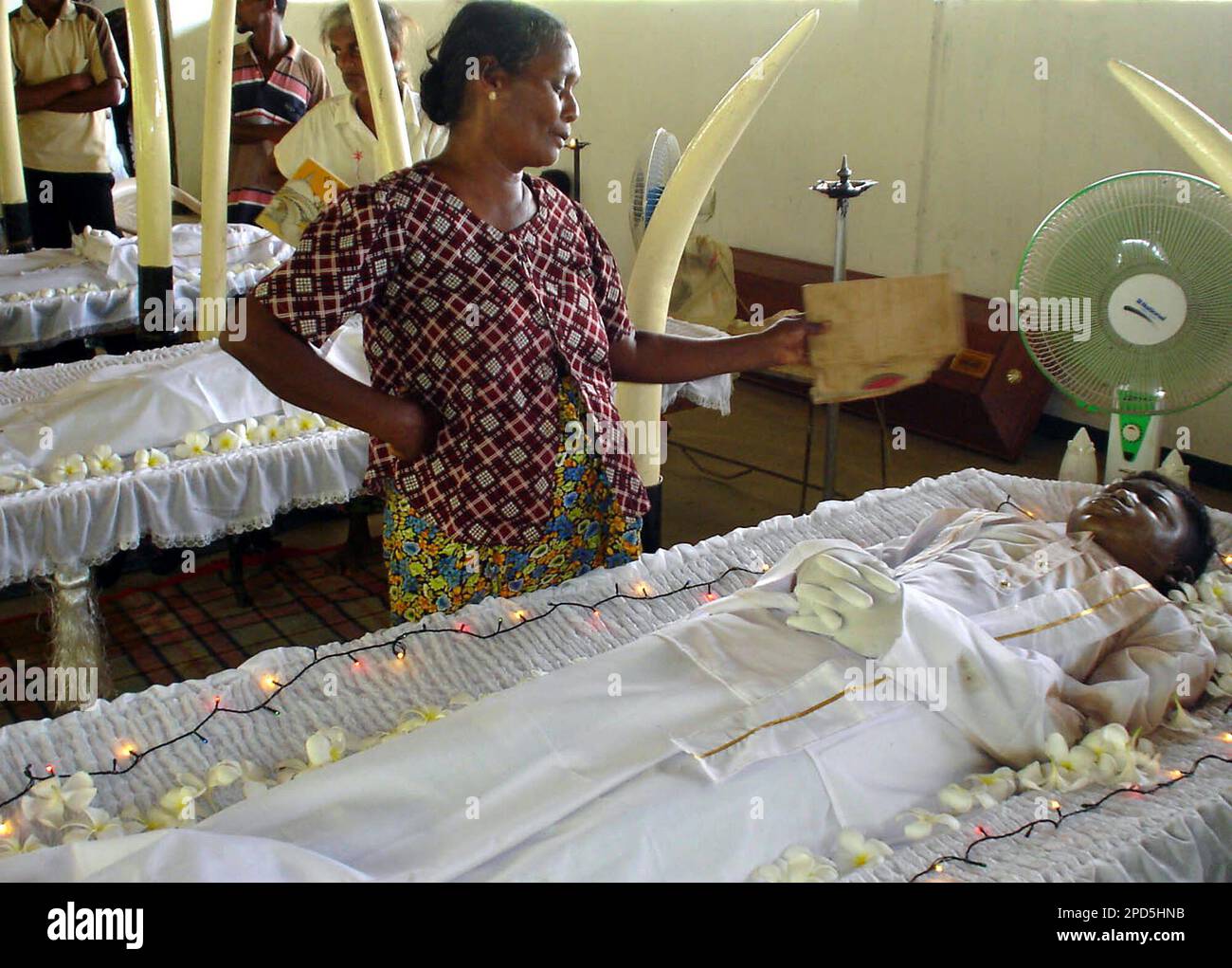 Chandrawathi, mother of 16-year old Lalith Bandara, grieves during his ...
