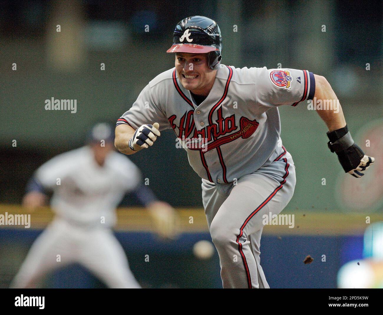 Atlanta Braves' Matthew Diaz races back to first as Milwaukee Brewers ...